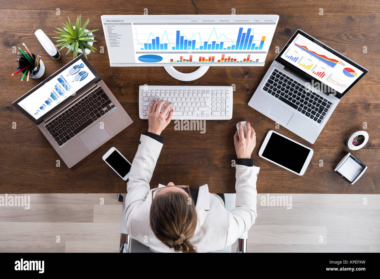 Businesswoman Working With Graphs On Computer Stock Photo - Alamy