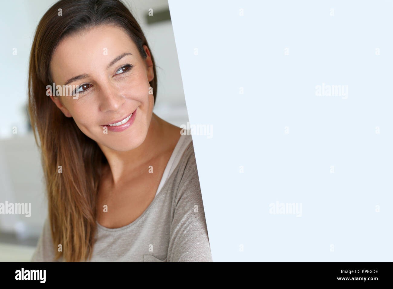 Smiling woman with happy look on her face Stock Photo - Alamy