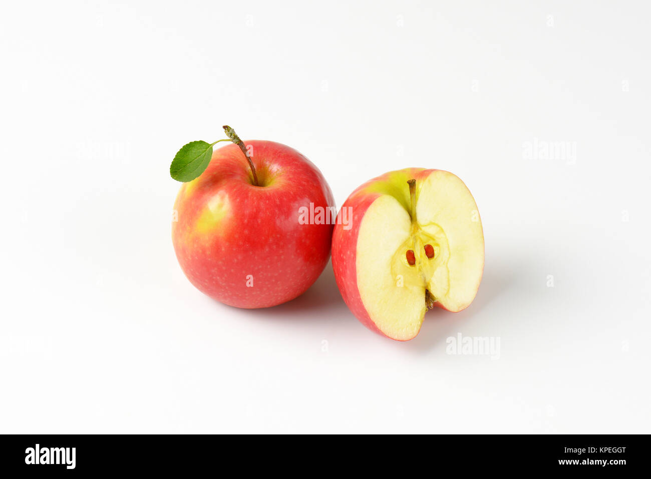 one and a half apples Stock Photo - Alamy