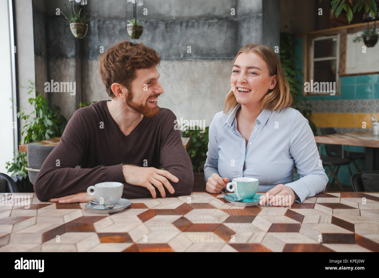 Beautiful young couple having coffee hi-res stock photography and ...