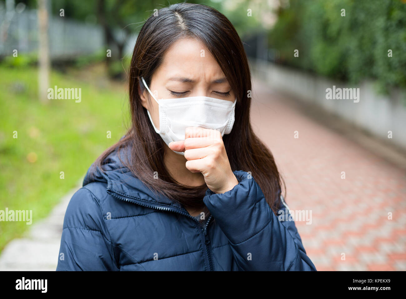 Asian woman wearing face mask Stock Photo - Alamy