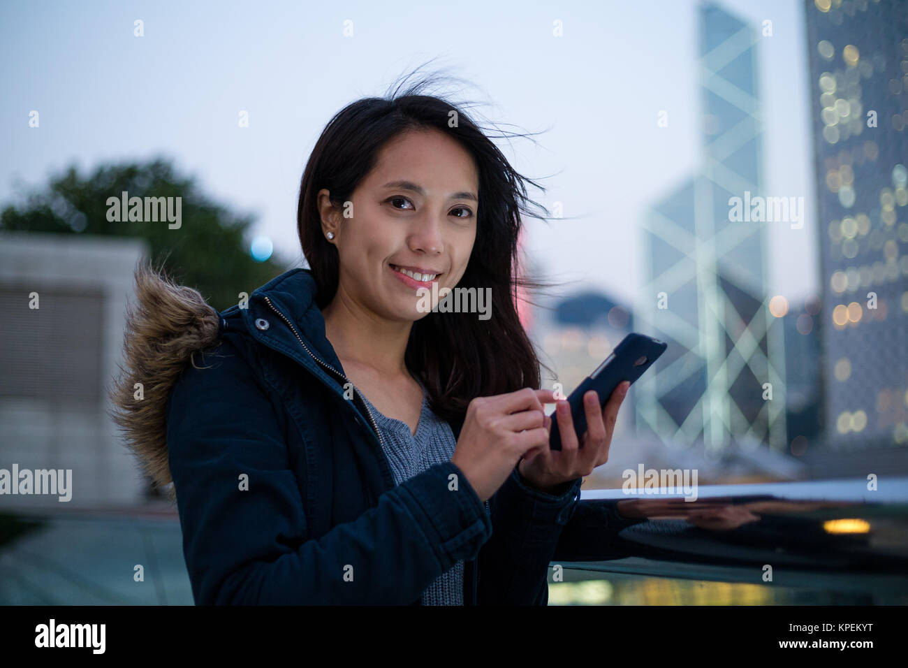 Asian Woman use mobile phone at night Stock Photo - Alamy