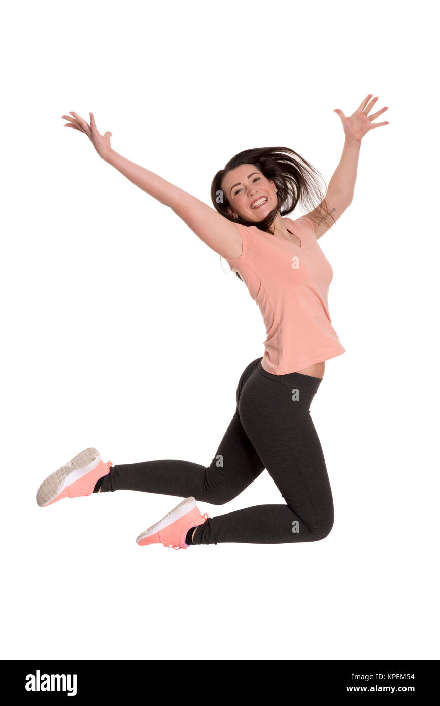 young woman doing a leap of joy Stock Photo - Alamy
