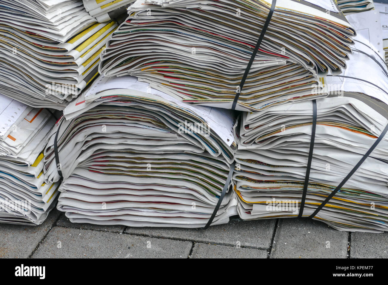 Stack of newspapers on the street Stock Photo - Alamy