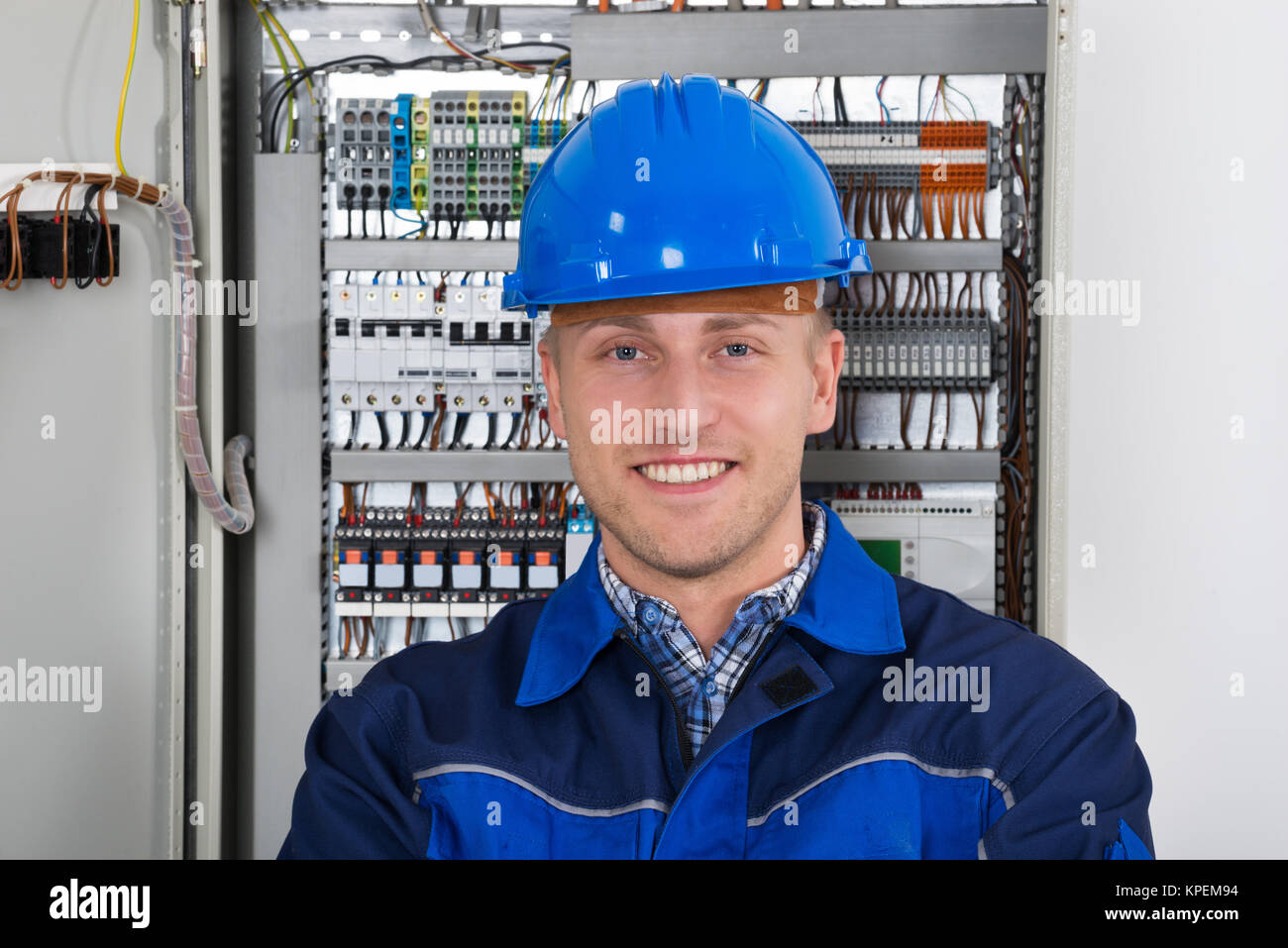 Portrait Of A Happy Young Male Electrician Stock Photo - Alamy