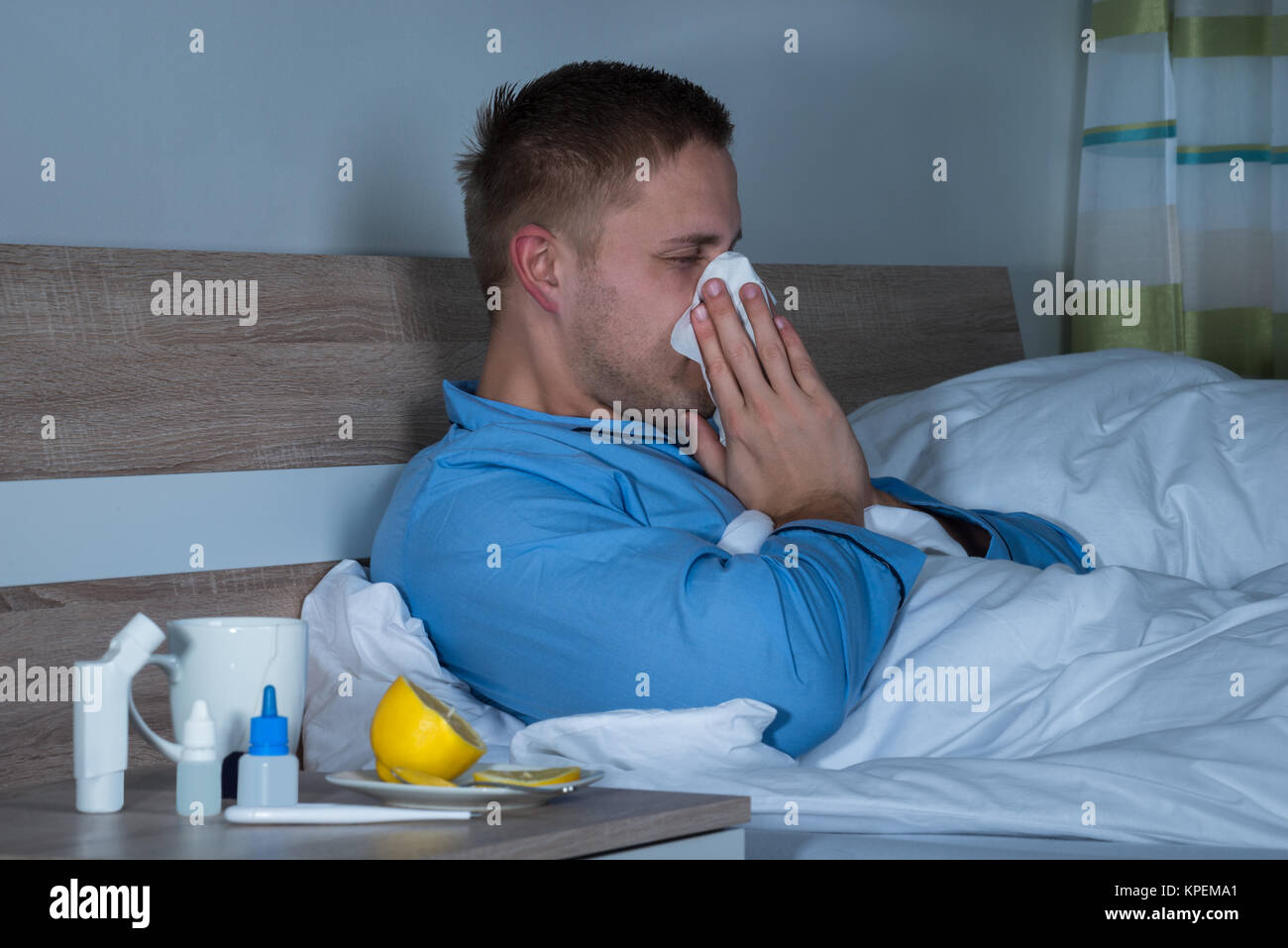 Man Infected With Cold Lying On Bed Stock Photo - Alamy