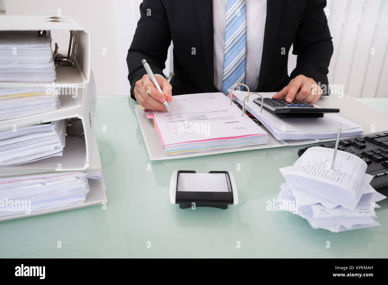 Businessman Calculating Invoice Stock Photo - Alamy Businessman Calculating Invoice Stock Photo - Alamy