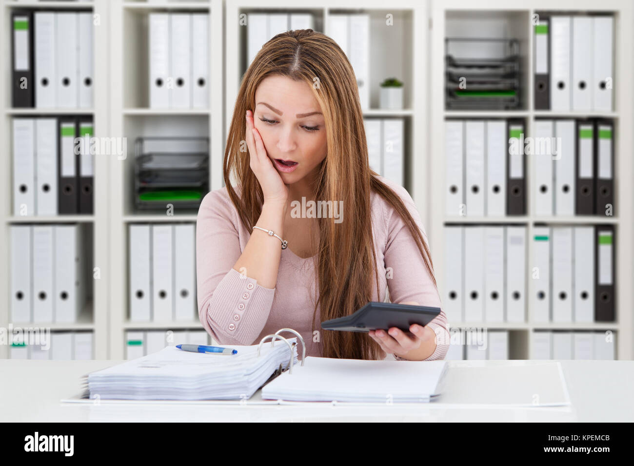 Young Woman Calculating Bills Stock Photo - Alamy