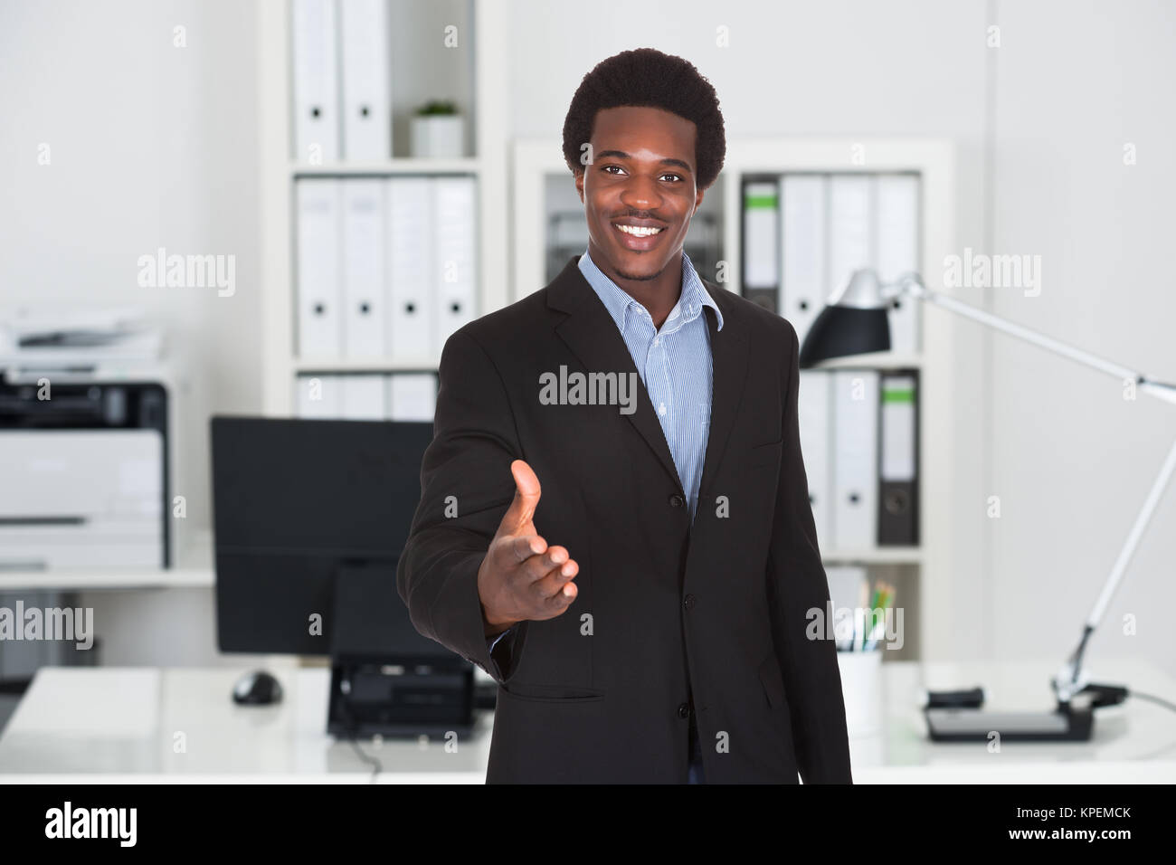 Businessman Offering Handshake Stock Photo - Alamy