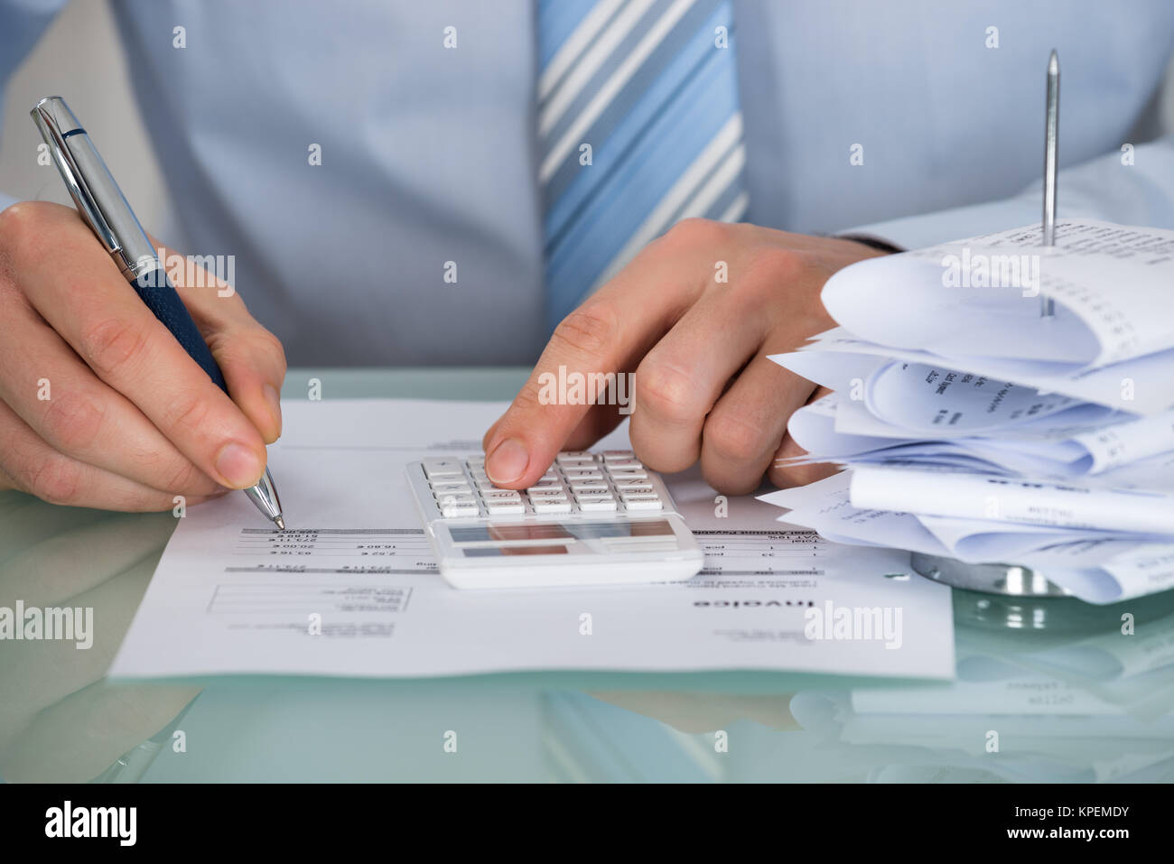 Businessman Calculating Invoice Stock Photo - Alamy Businessman Calculating Invoice Stock Photo - Alamy