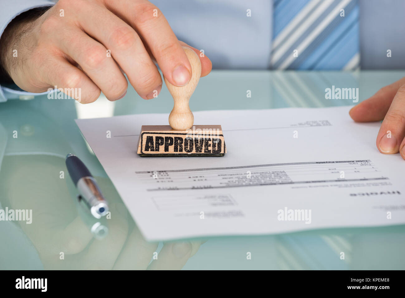 Person's Hand Stamping On Document Stock Photo - Alamy