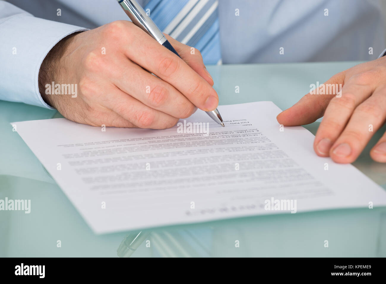 Businessman Signing Contract Form Stock Photo - Alamy