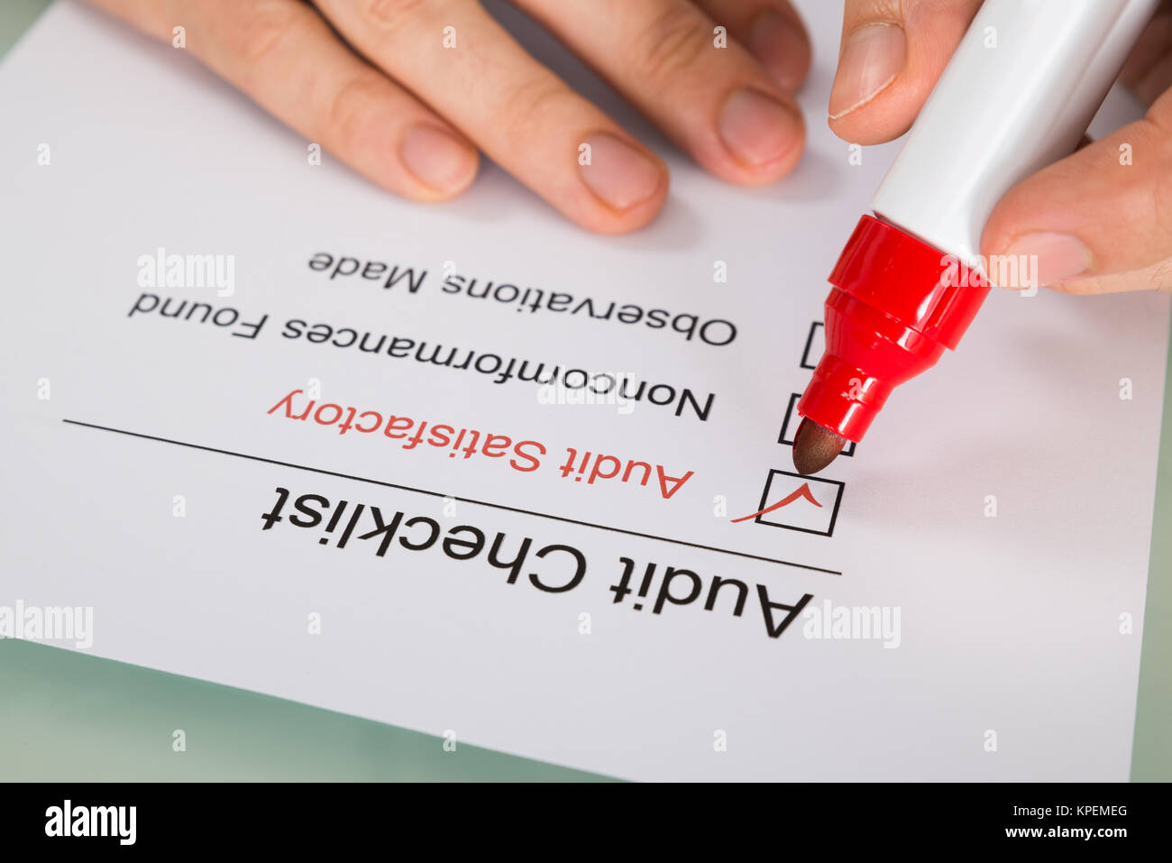 Person Filling Audit Checklist Form Stock Photo - Alamy