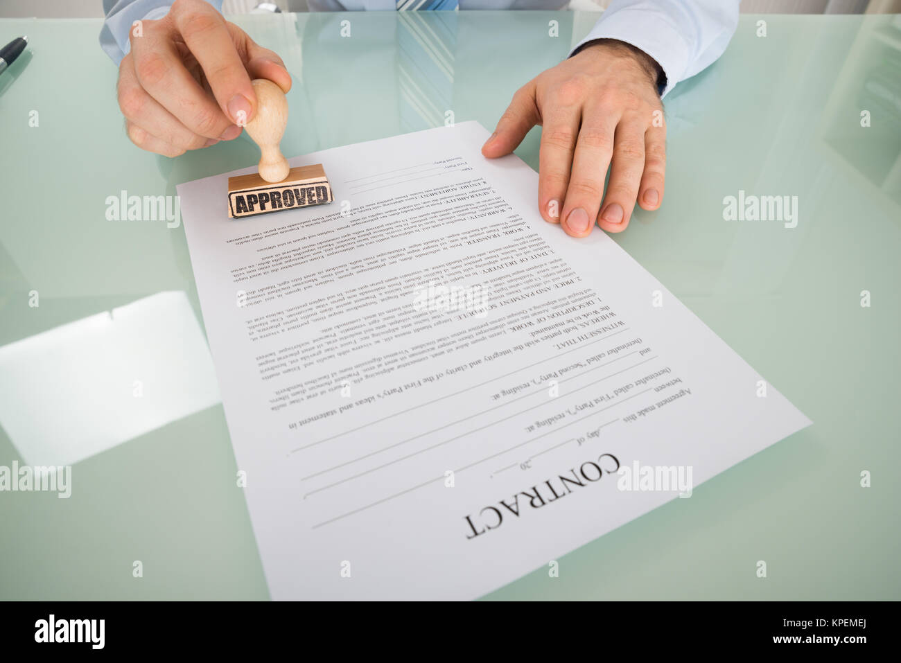 Businessman Stamping On Contract Form Stock Photo - Alamy