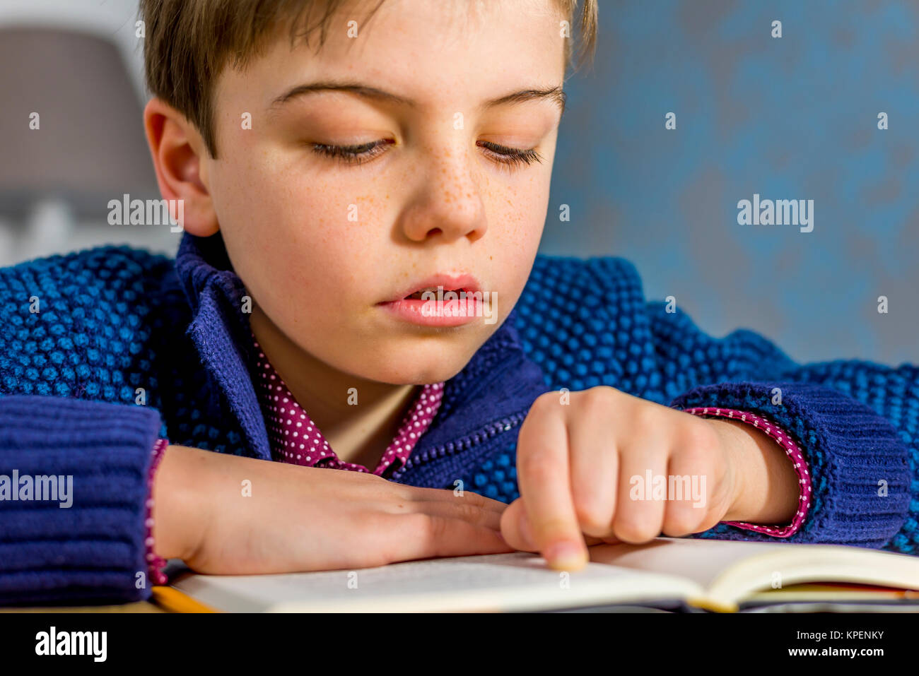 boy reading a book Stock Photo - Alamy
