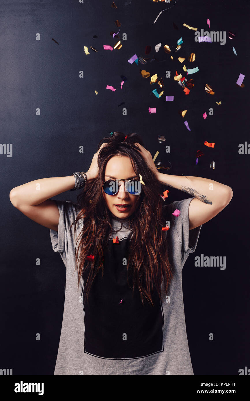 Adorable girl having fun with confetti Stock Photo - Alamy