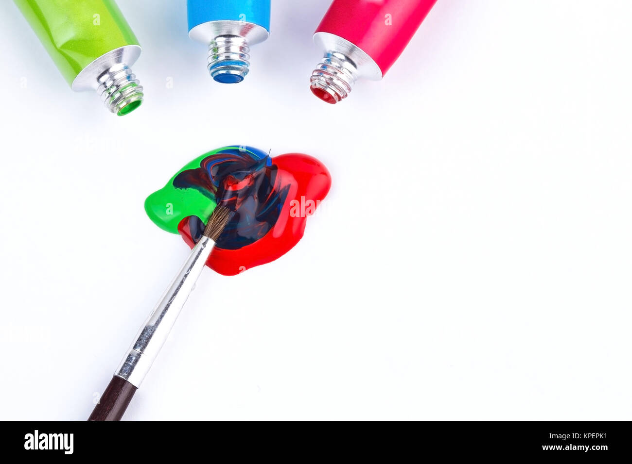 Water based paints with paintbrush mixing colors Stock Photo - Alamy
