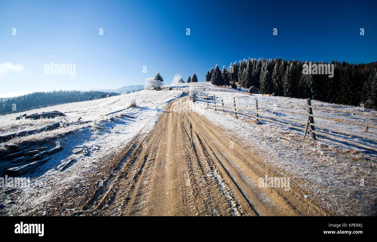 Winter dirt road on the top of the hills Stock Photo - Alamy