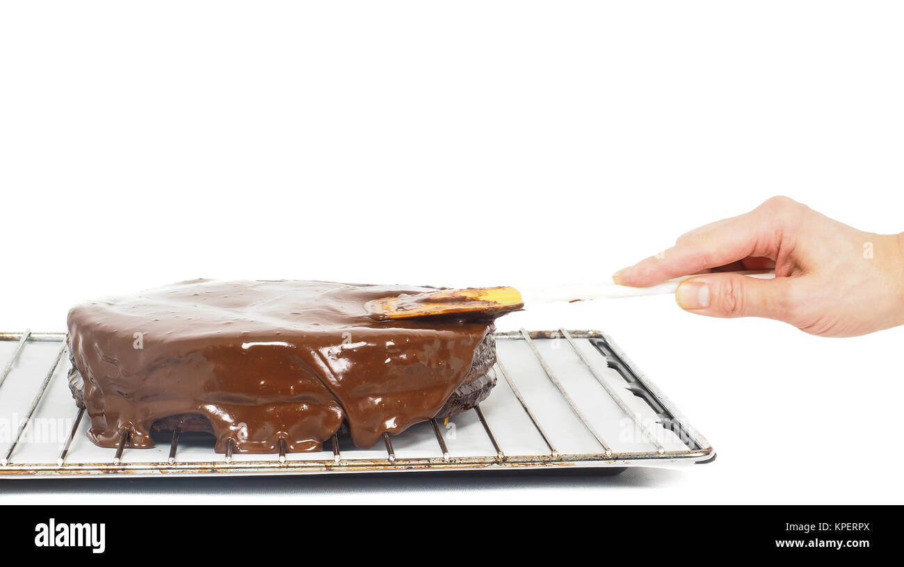 Pastry chef making final touches to a sacher chocolate cake Stock Photo ...