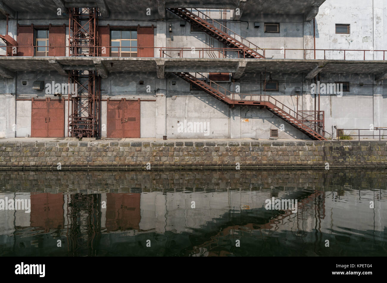 Old factory building along the canal Stock Photo - Alamy