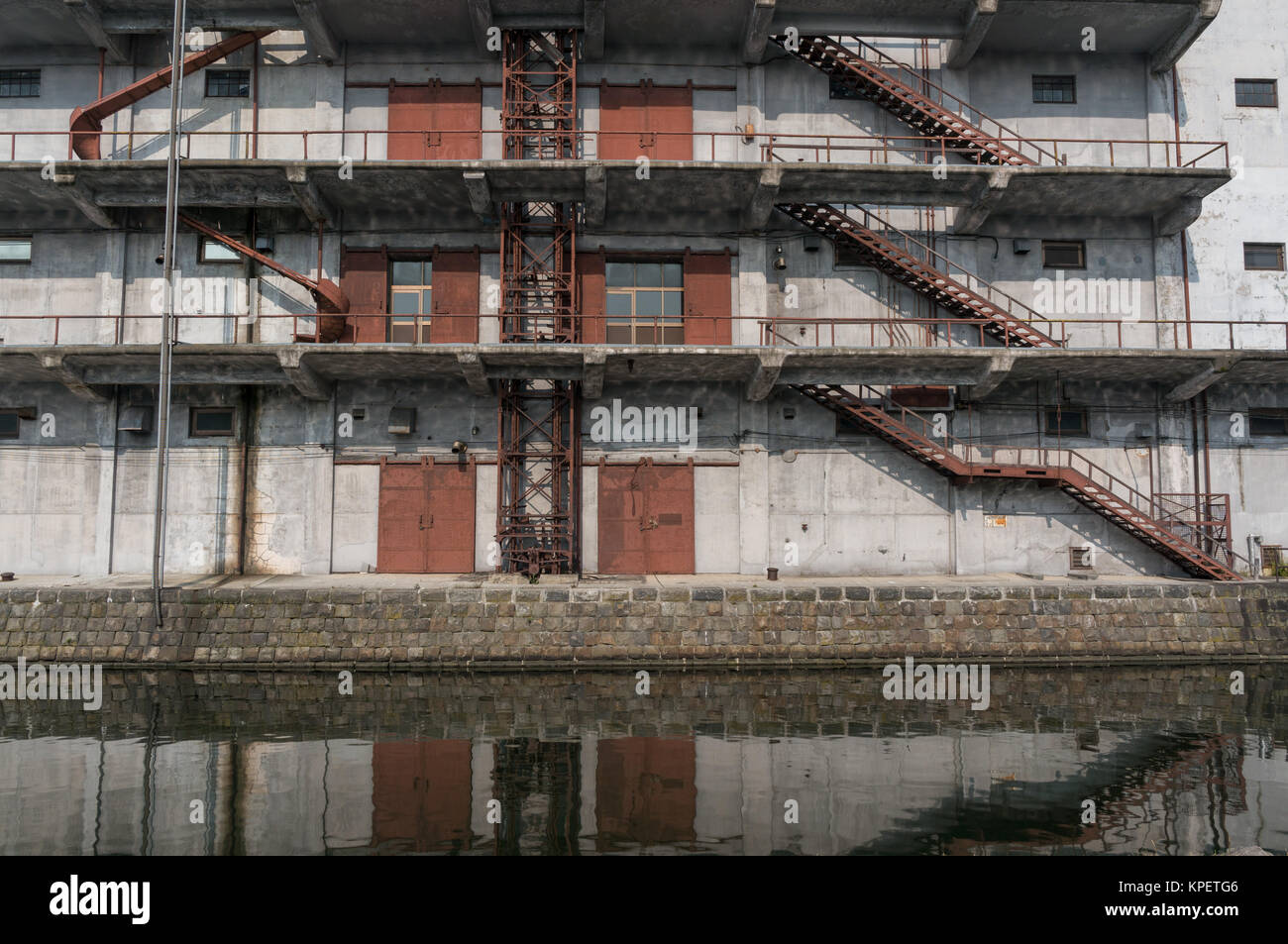 Old factory building along the canal Stock Photo - Alamy