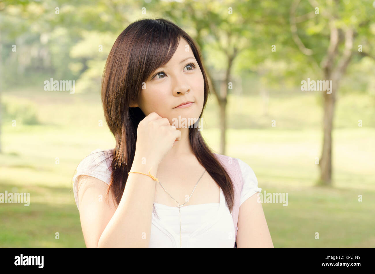 Young Asian college girl student thinking Stock Photo - Alamy