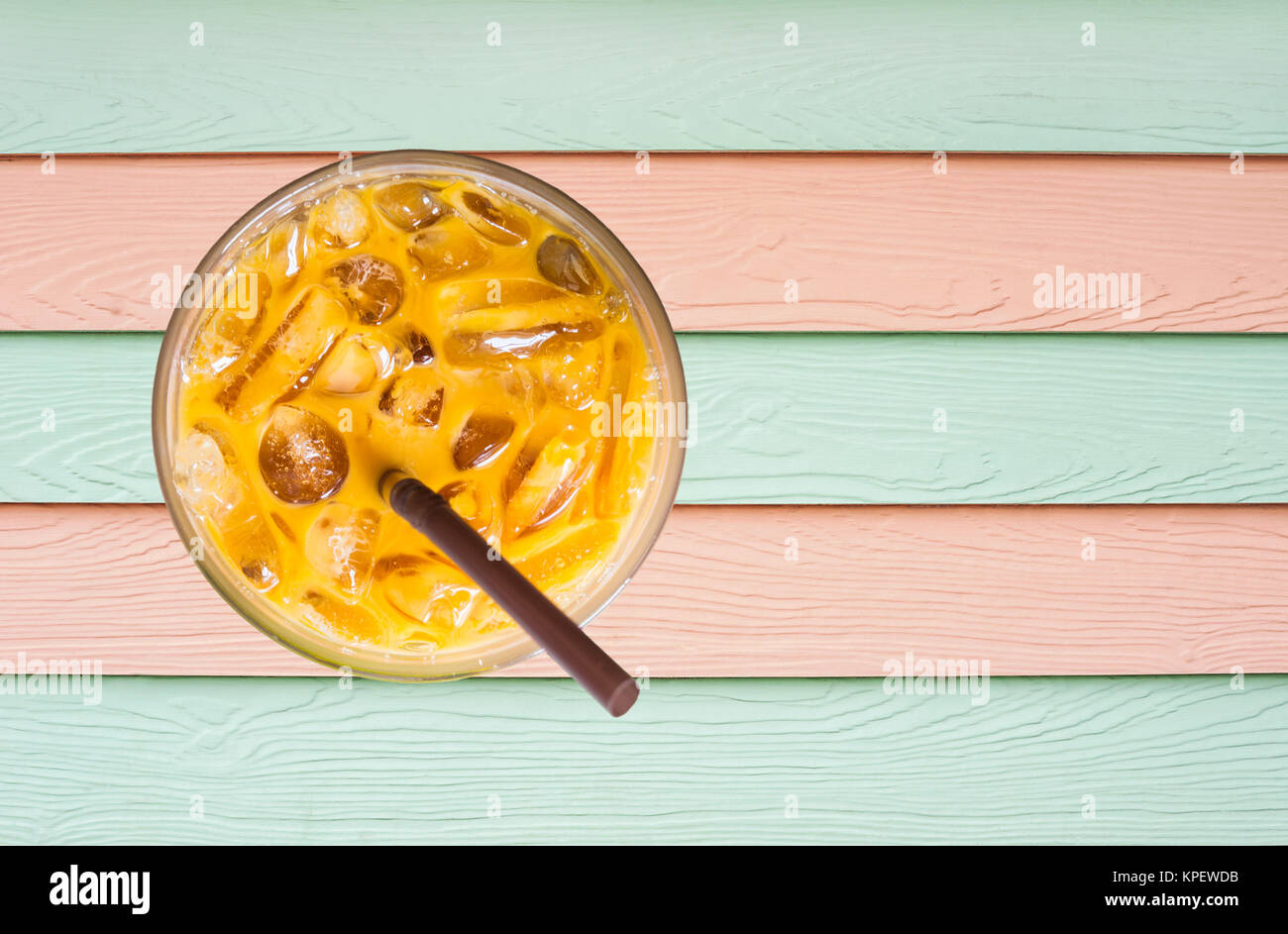 Ice milk tea on wood texture Stock Photo - Alamy
