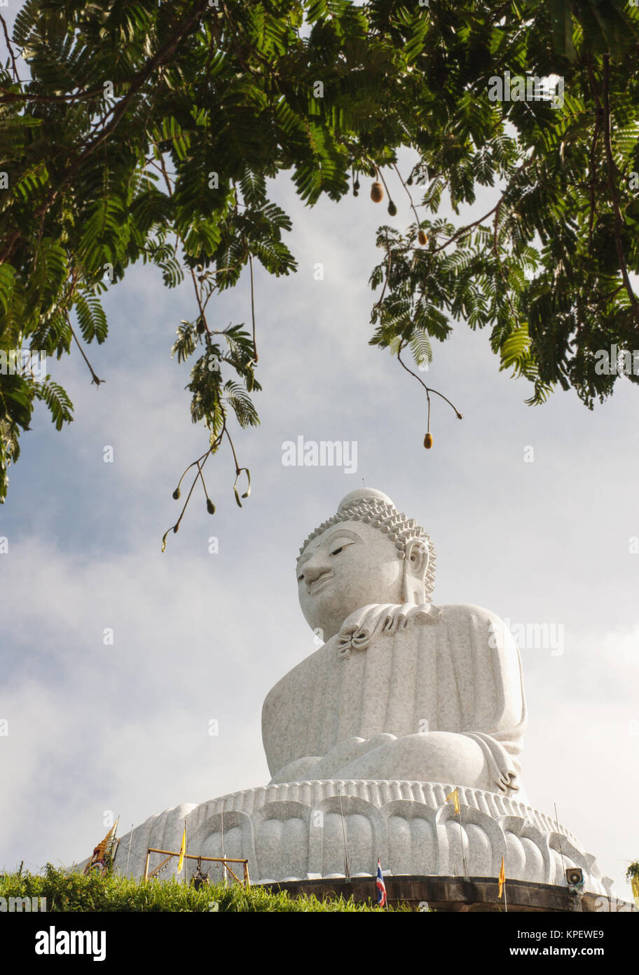 Big buddha in blurred tree border and sky Stock Photo - Alamy