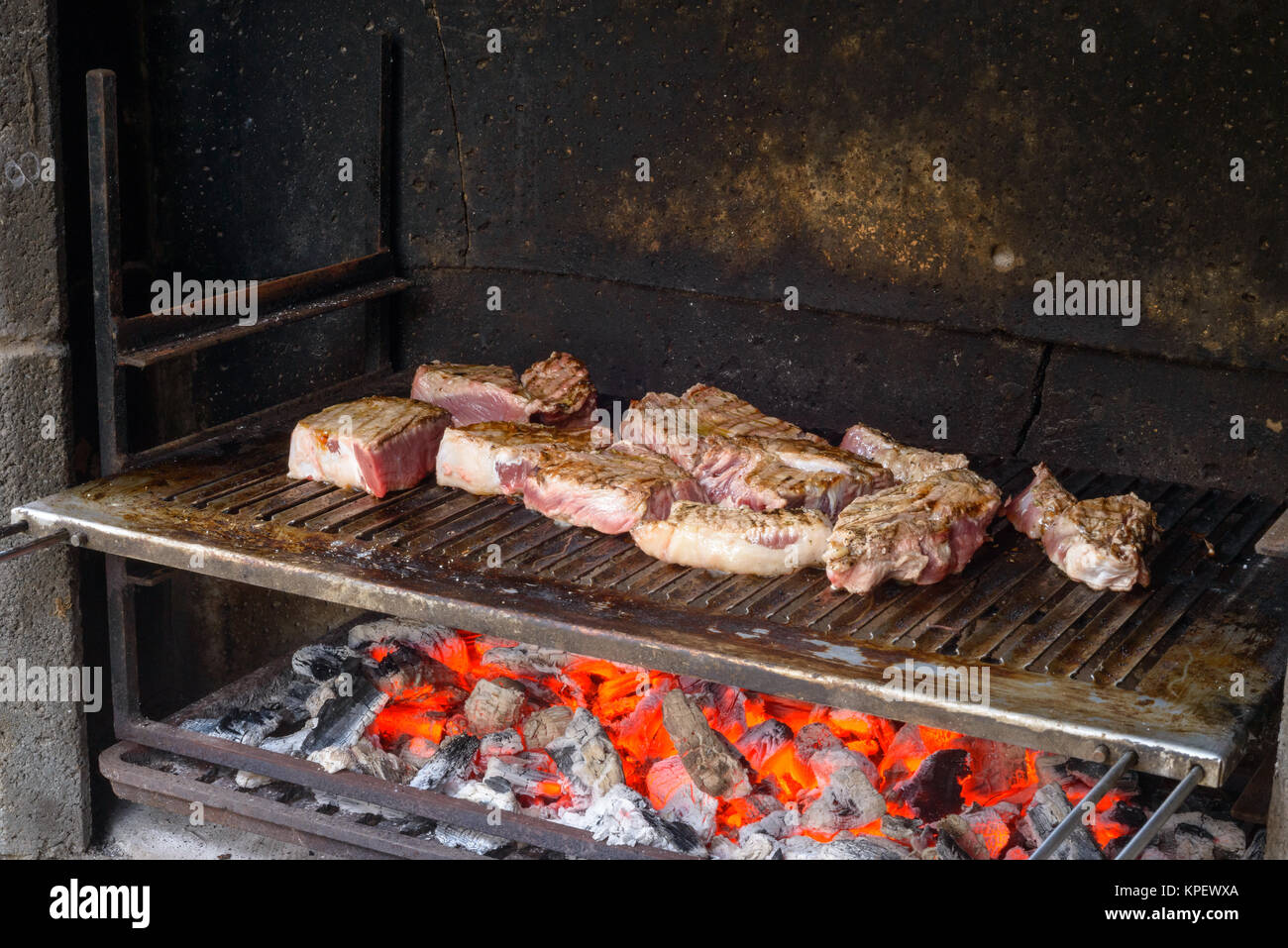 Grilling beef meat Stock Photo - Alamy