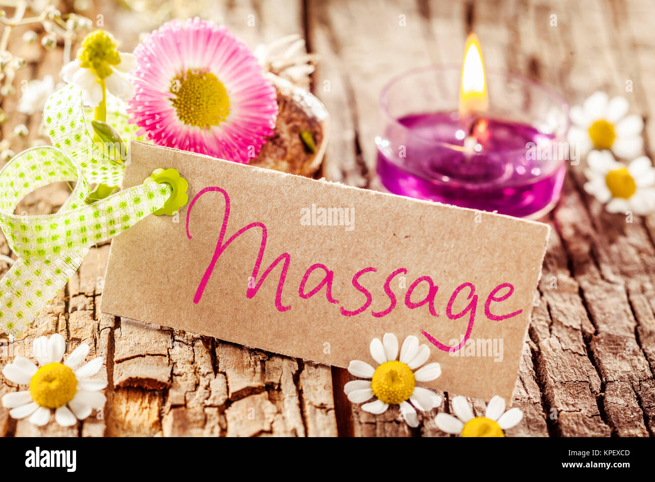 Beautiful display of handwritten massage sign placed on tree bark ...