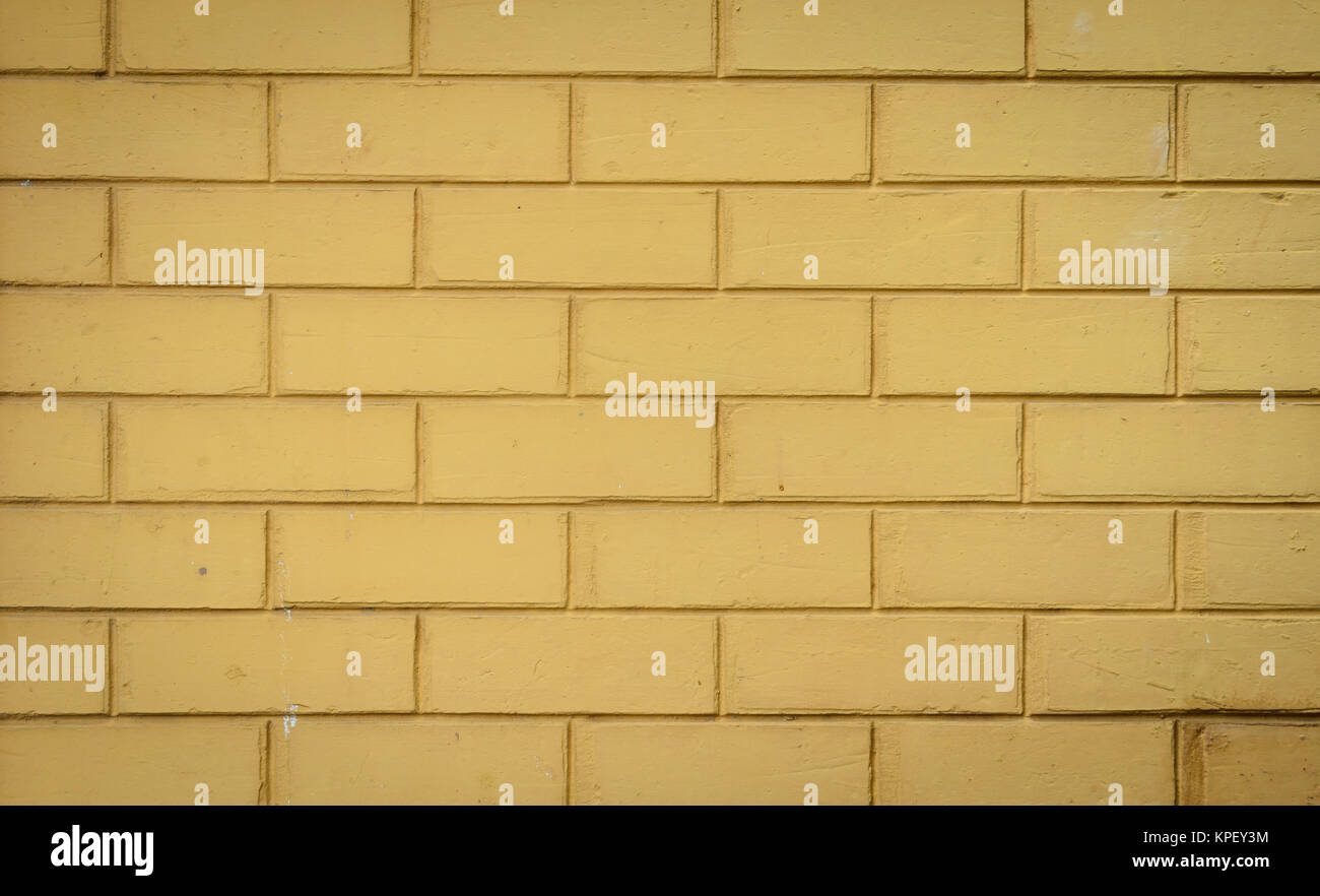 Yellow brick wall background Stock Photo - Alamy