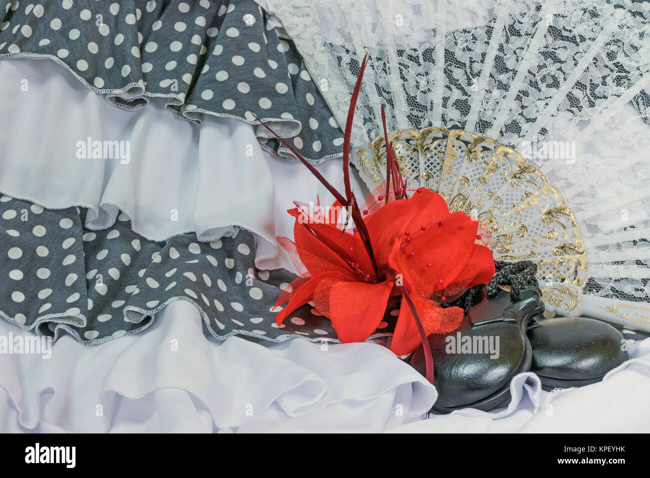 Clothing for Flamenco in white with red rose Stock Photo - Alamy