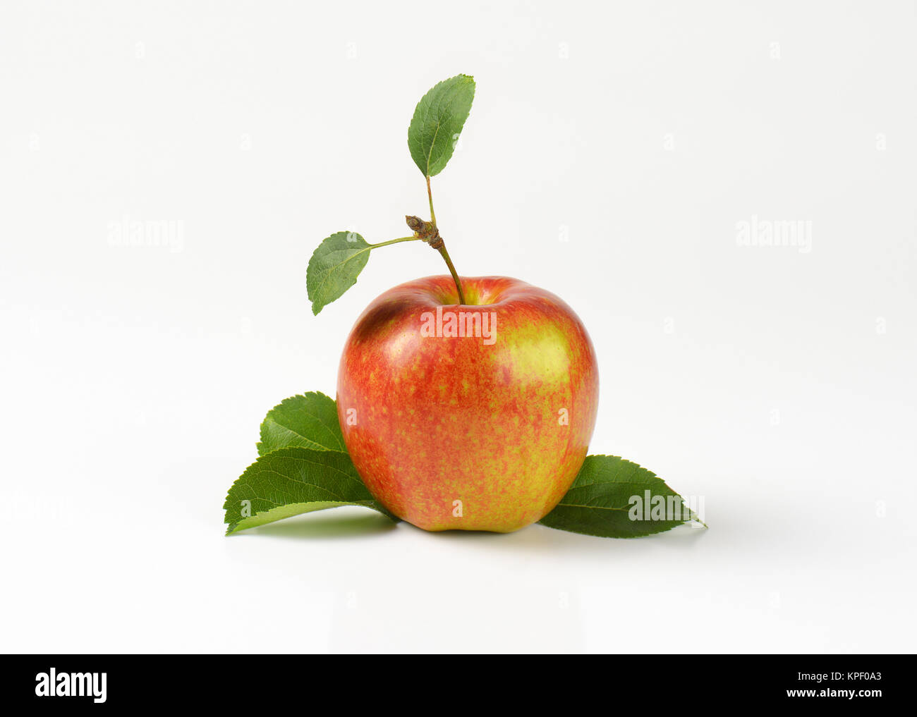 red apple with leaves Stock Photo - Alamy