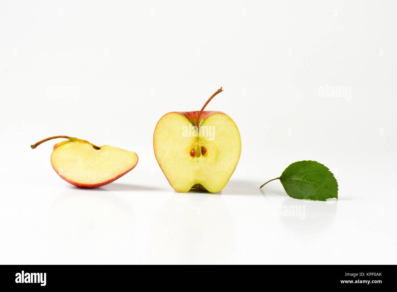 fresh apple half and quarter Stock Photo - Alamy