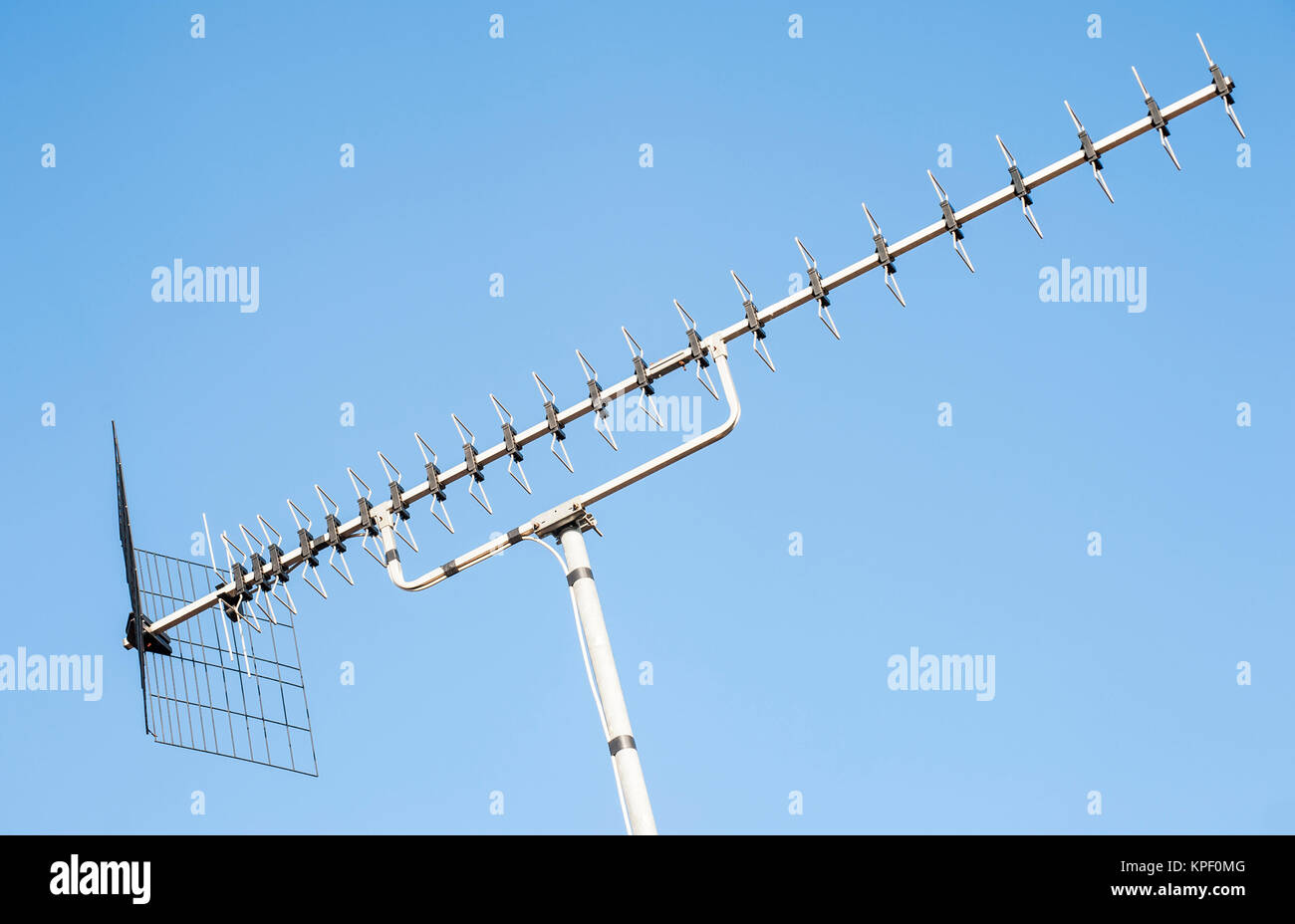 Television Aerial the background of a blue sky Stock Photo - Alamy