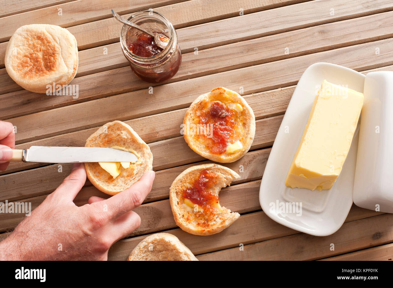 Man buttering bread hi-res stock photography and images - Alamy