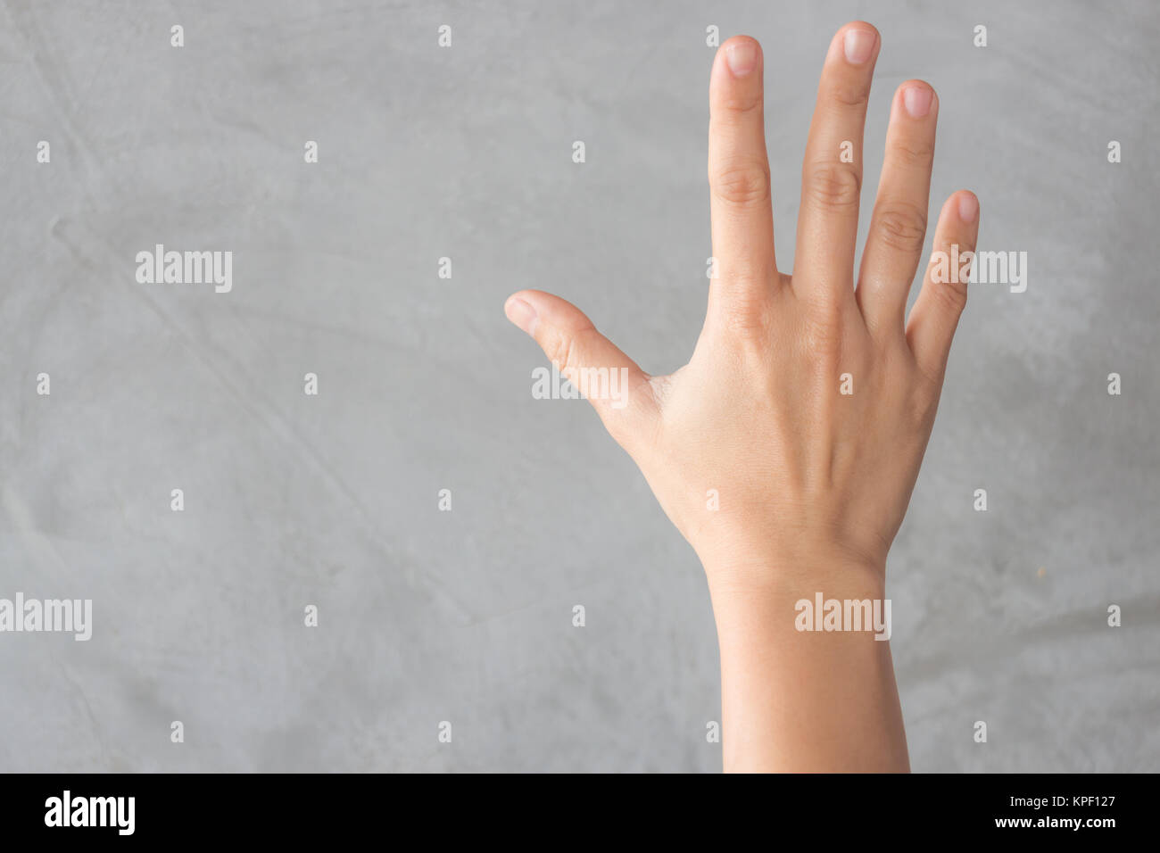 Hand action gesture on grey background Stock Photo - Alamy