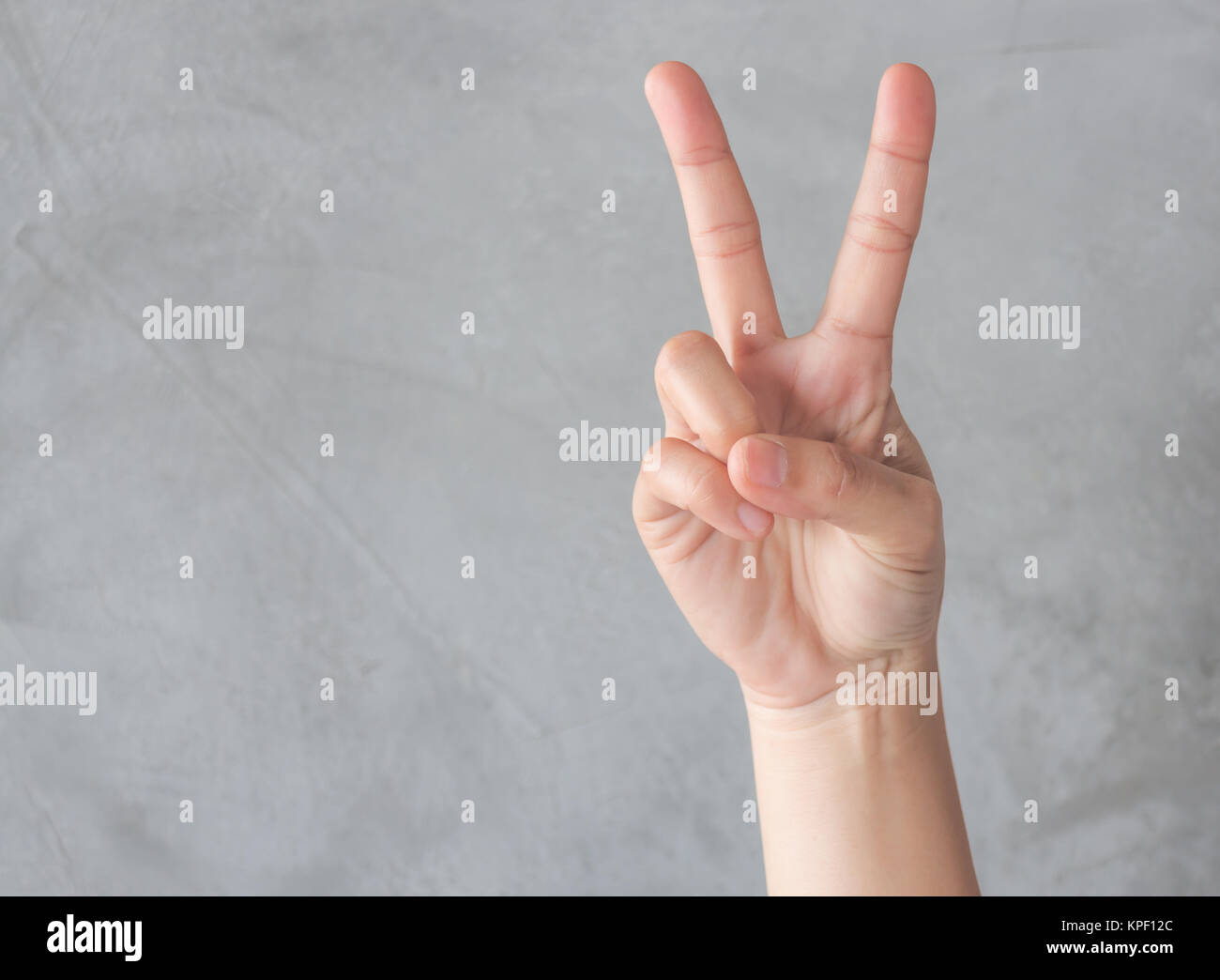 Hand action gesture on grey background Stock Photo - Alamy