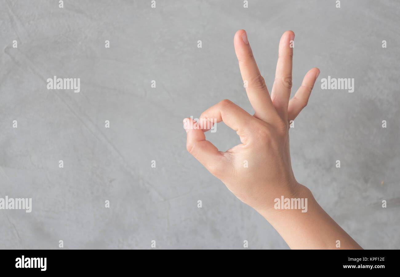 Hand action gesture on grey background Stock Photo - Alamy
