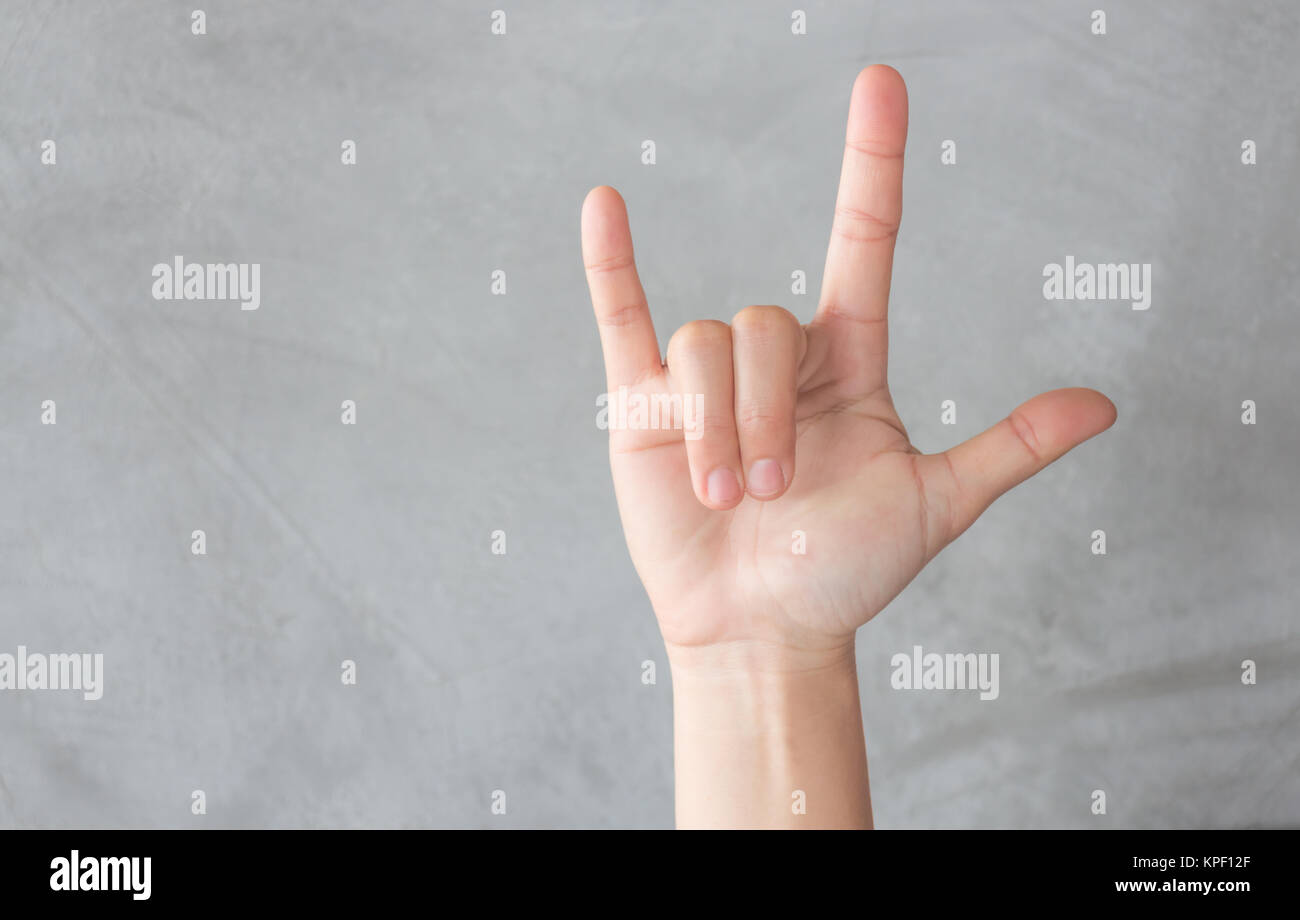 Hand action gesture on grey background Stock Photo - Alamy