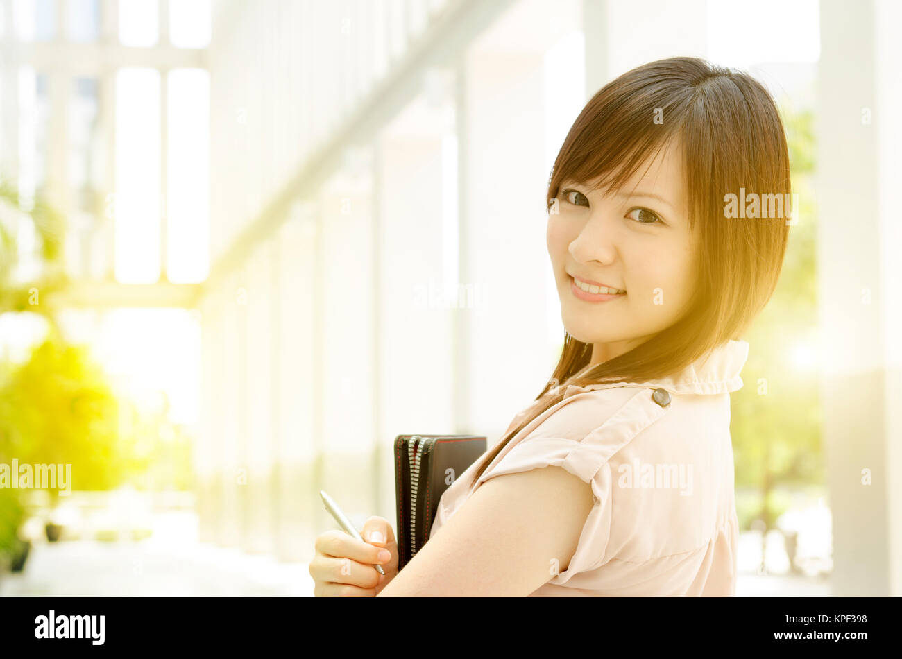 Young Asian female executive at office Stock Photo - Alamy