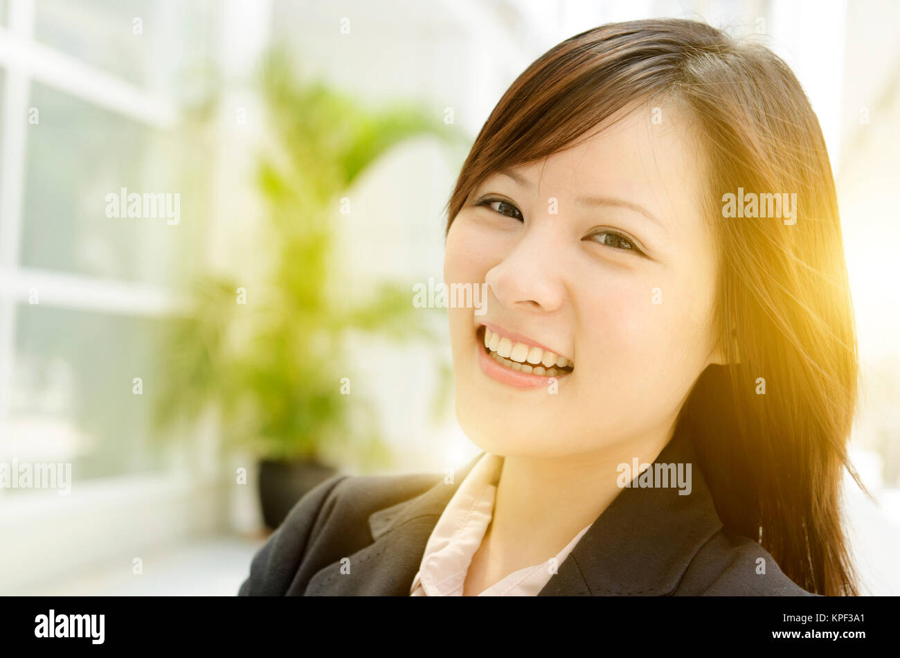 Cheerful young Asian business woman Stock Photo - Alamy Cheerful young Asian business woman Stock Photo - Alamy