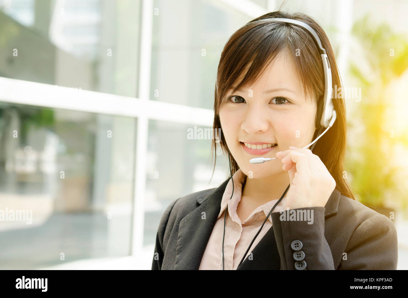 Asian female customer helpline Stock Photo - Alamy