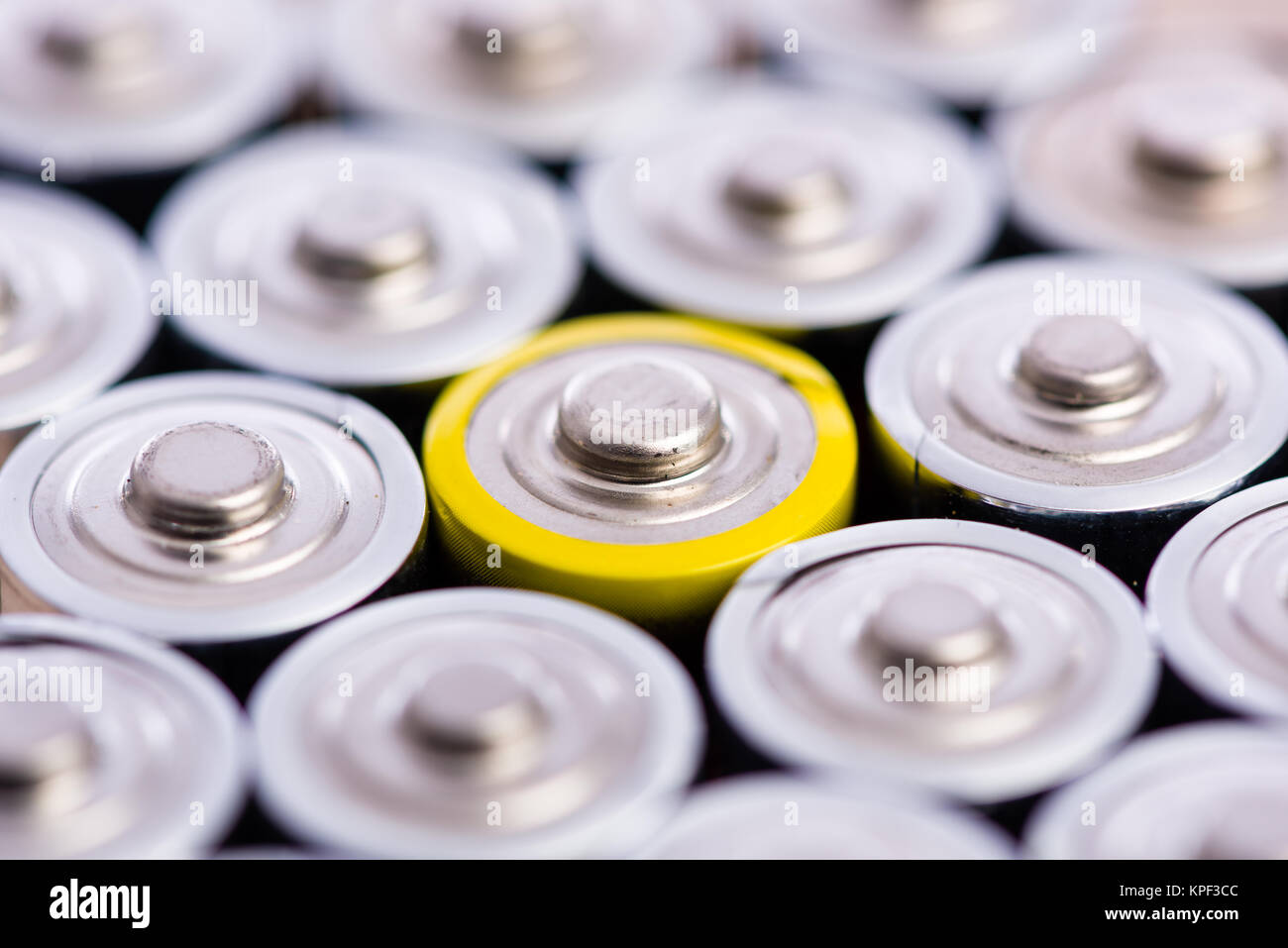 One is always different - group of batteries in row pattern Stock Photo ...