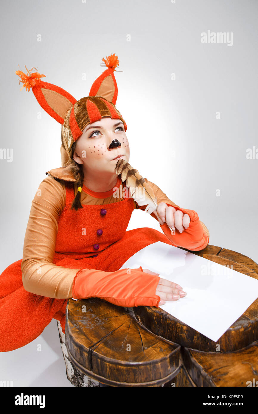 Young woman in image of squirrel writing with quill pen Stock Photo - Alamy