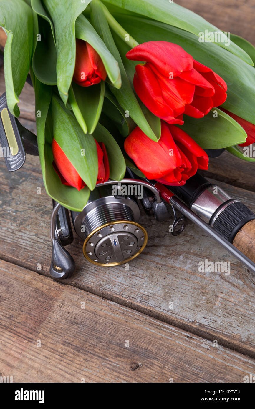 fishing tackles with bouquet spring flowers Stock Photo - Alamy