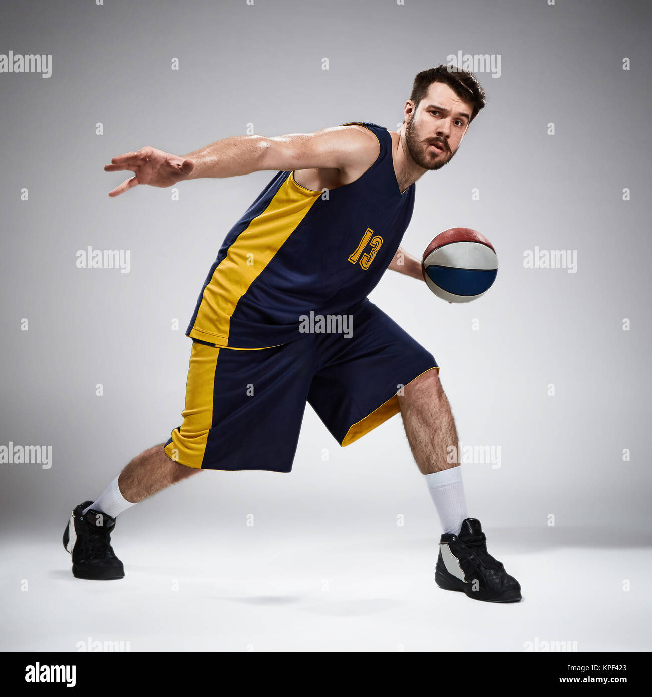 Full length portrait of a basketball player with ball Stock Photo - Alamy