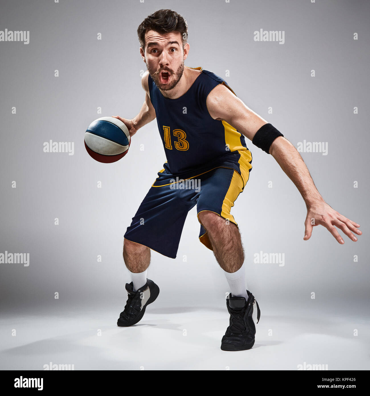 Full length portrait of a basketball player with ball Stock Photo - Alamy