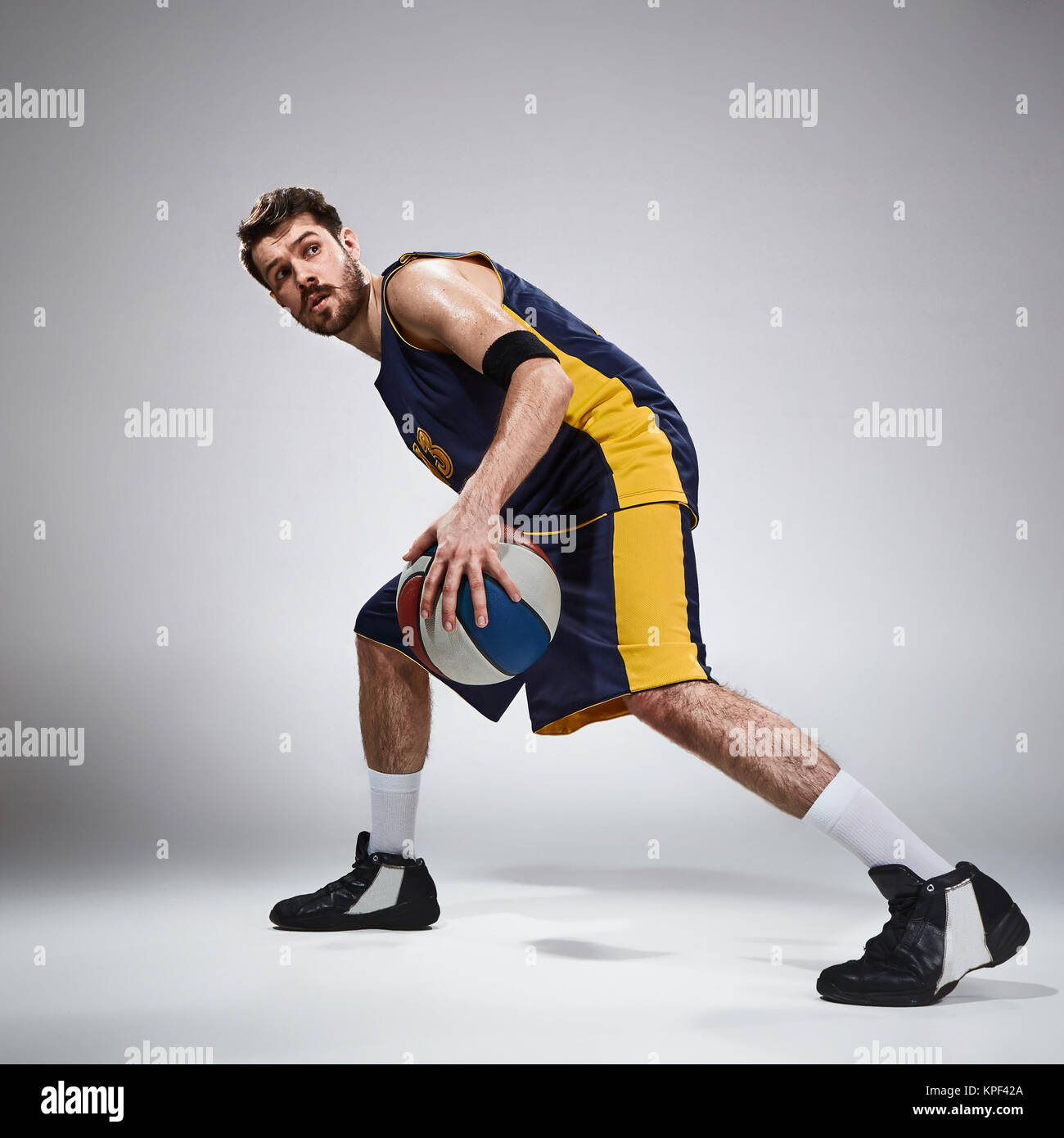 Full length portrait of a basketball player with ball Stock Photo - Alamy