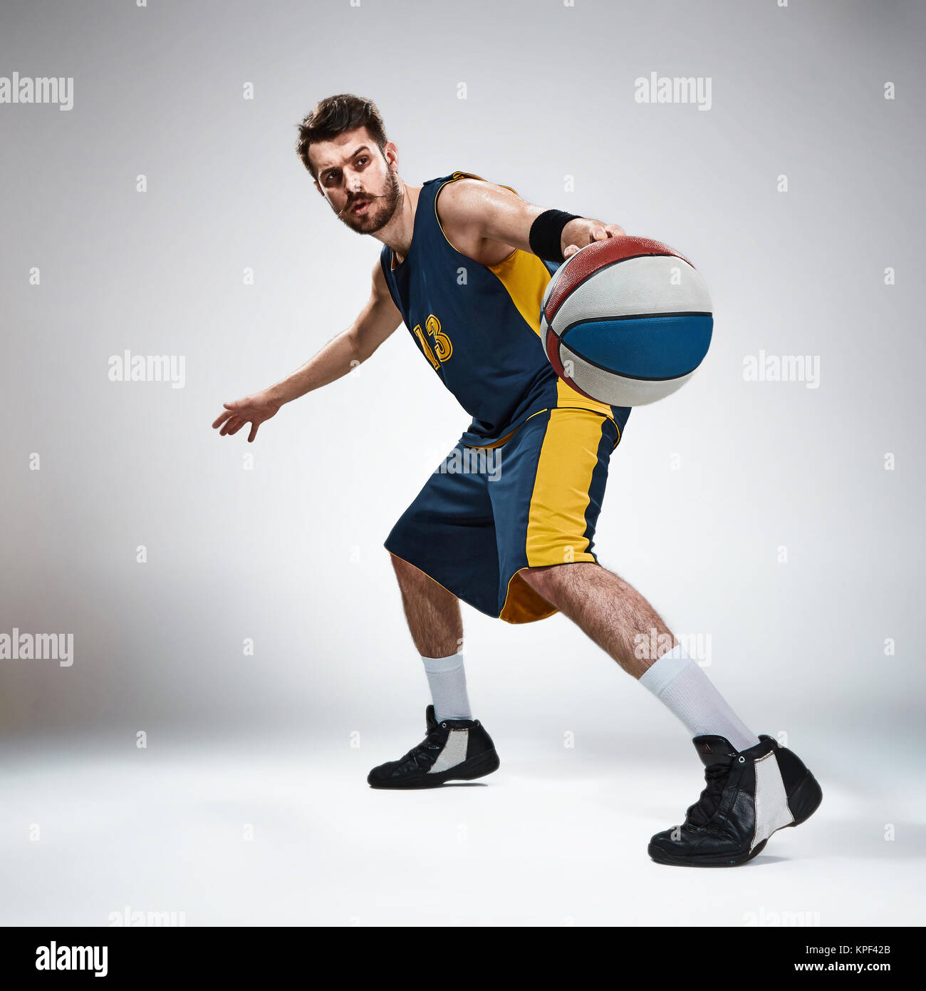 Full length portrait of a basketball player with ball Stock Photo - Alamy
